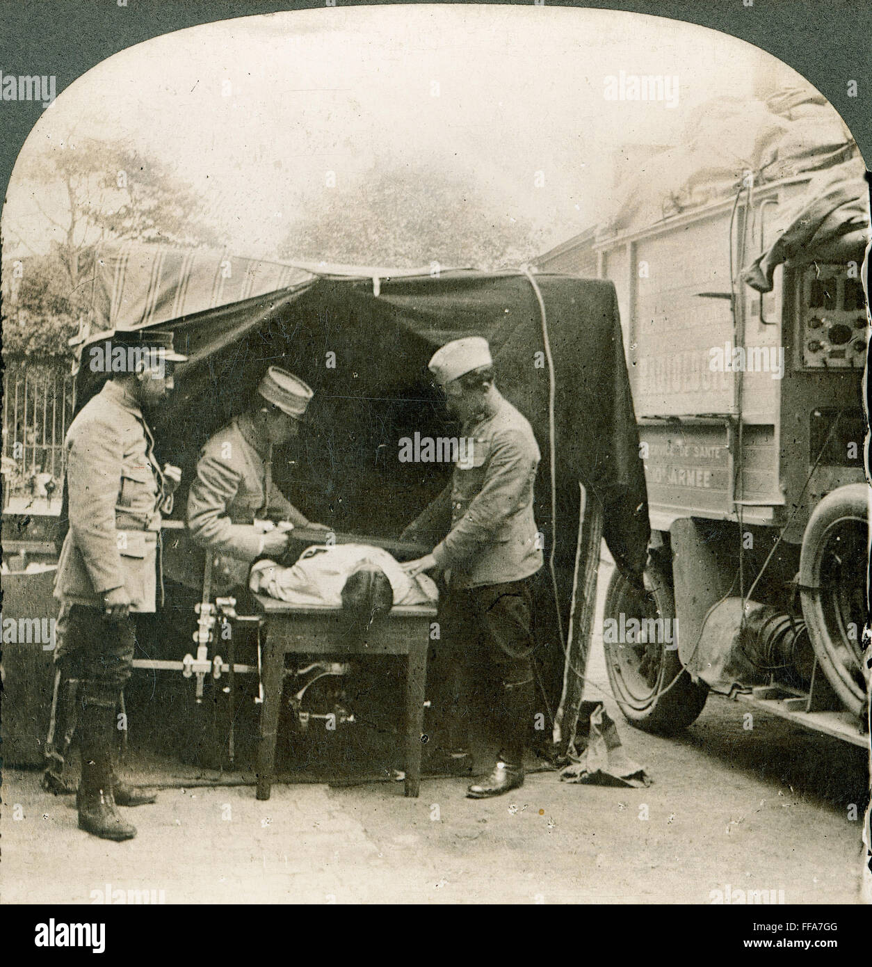 WORLD WAR I: FIELD HOSPITAL. /nFrench medics locating a bullet with an ...