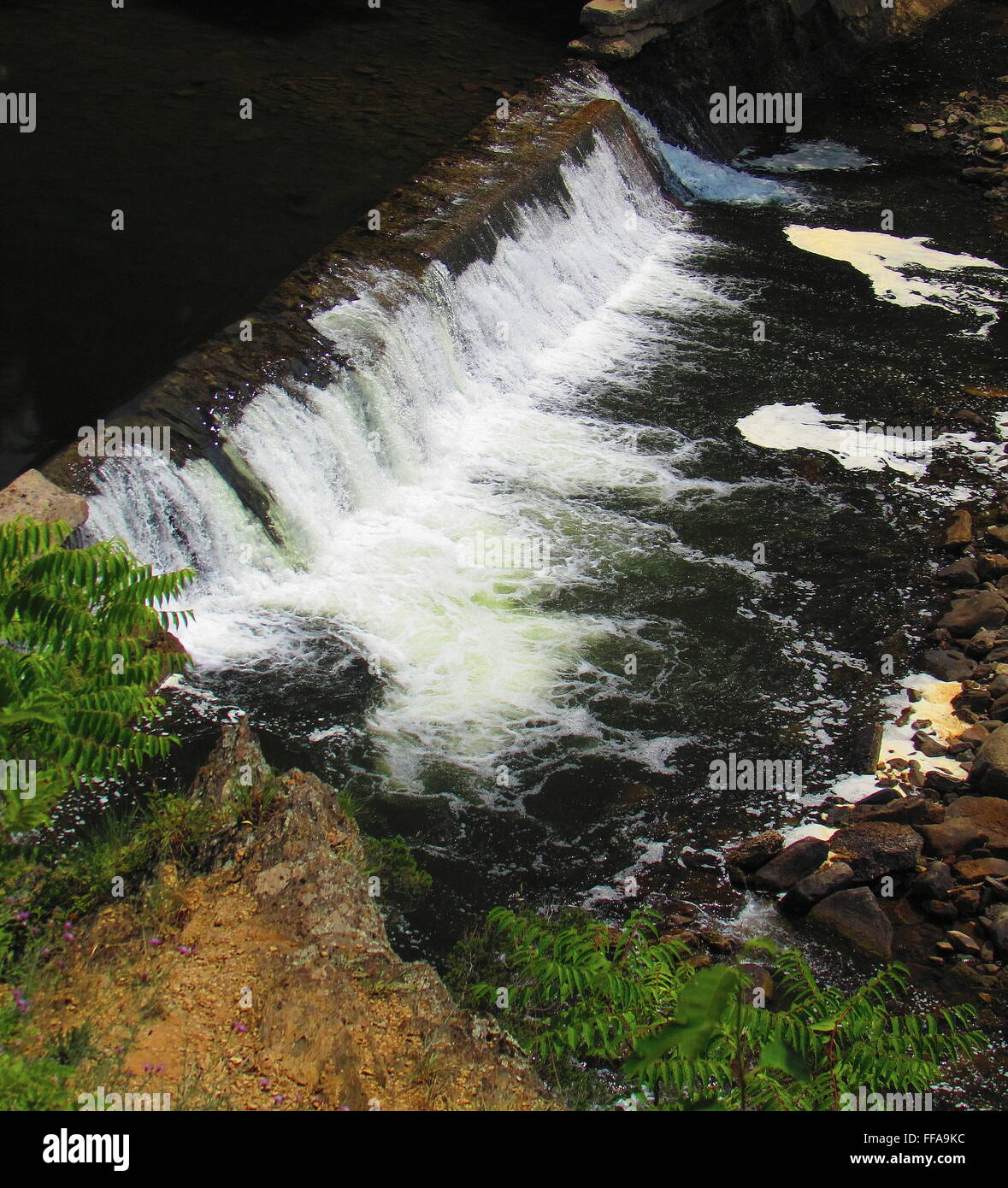 waterfalls over an old dam Stock Photo - Alamy