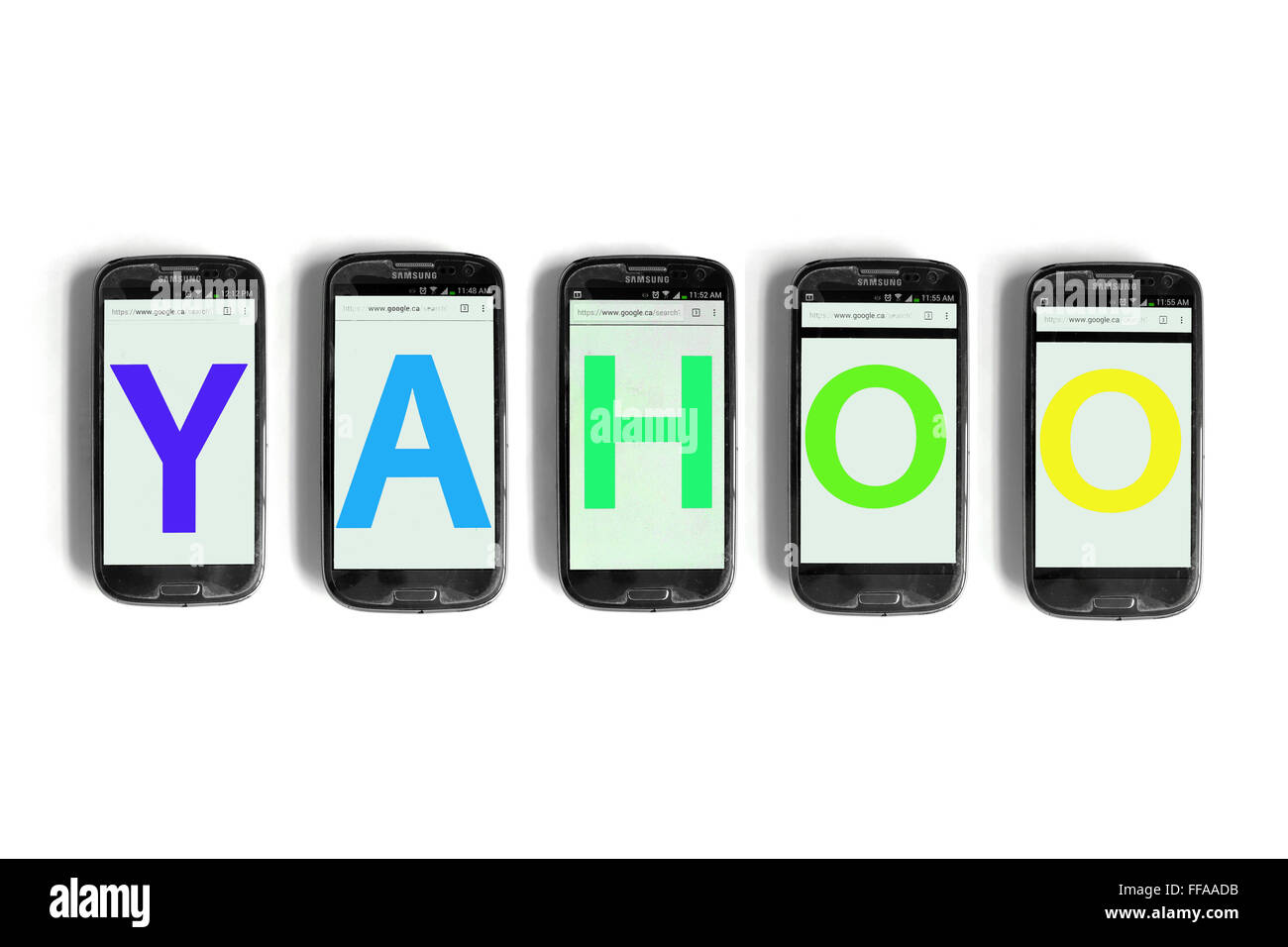 Yahoo on the screens of smartphones photographed against a white ...