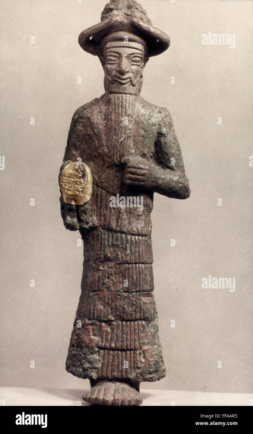 NEO-SUMERIAN BEARDED GOD./nBronze and gold statuette of a Neo-Sumerian ...