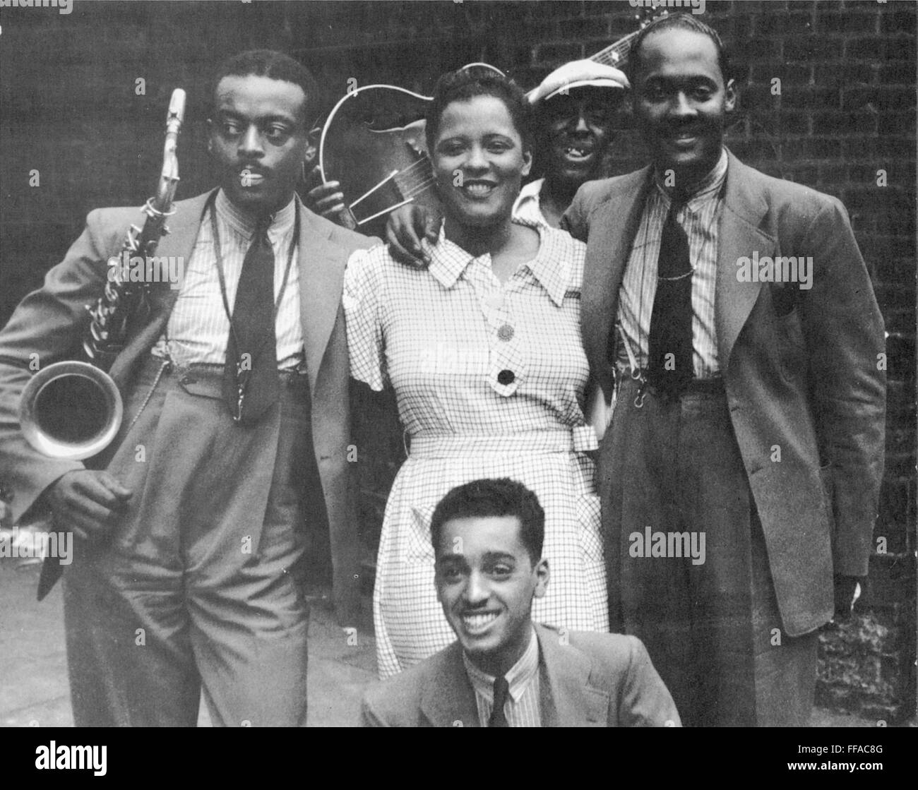 BILLIE HOLIDAY (1915-1959). /nAmerican singer. In a Harlem alley with ...