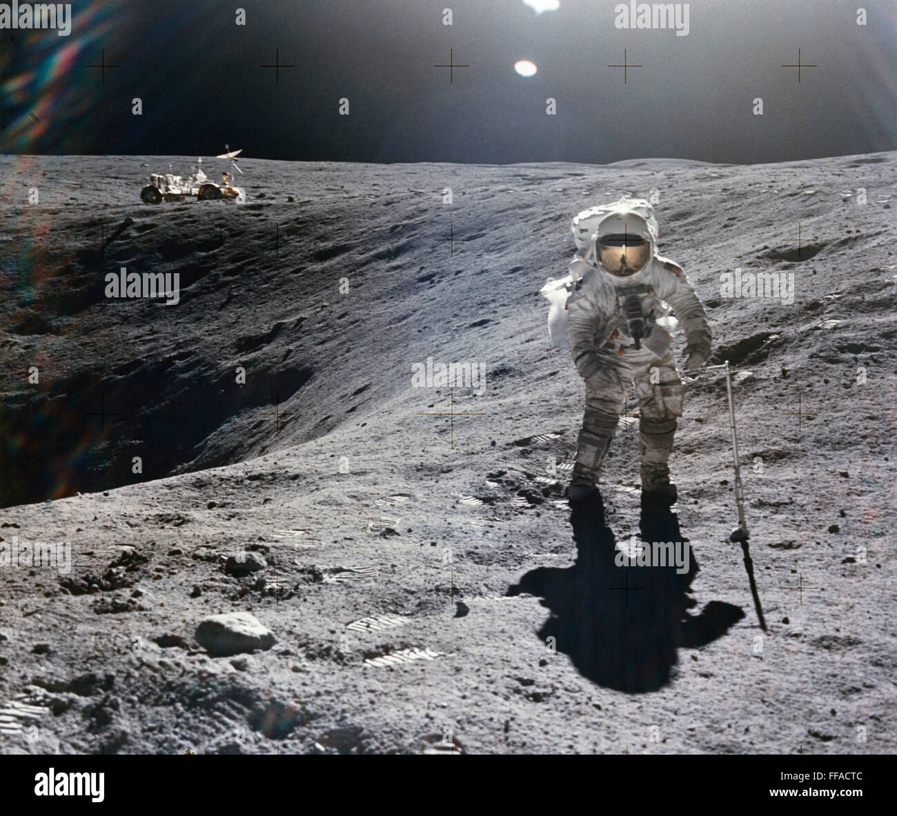 APOLLO 16, 1972. /nAstronaut Charles M. Duke collecting lunar samples ...