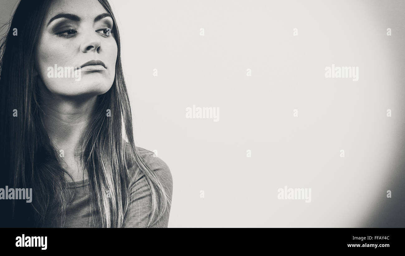 haughty woman looks down. Attractive woman sad face expression. Filtred ...