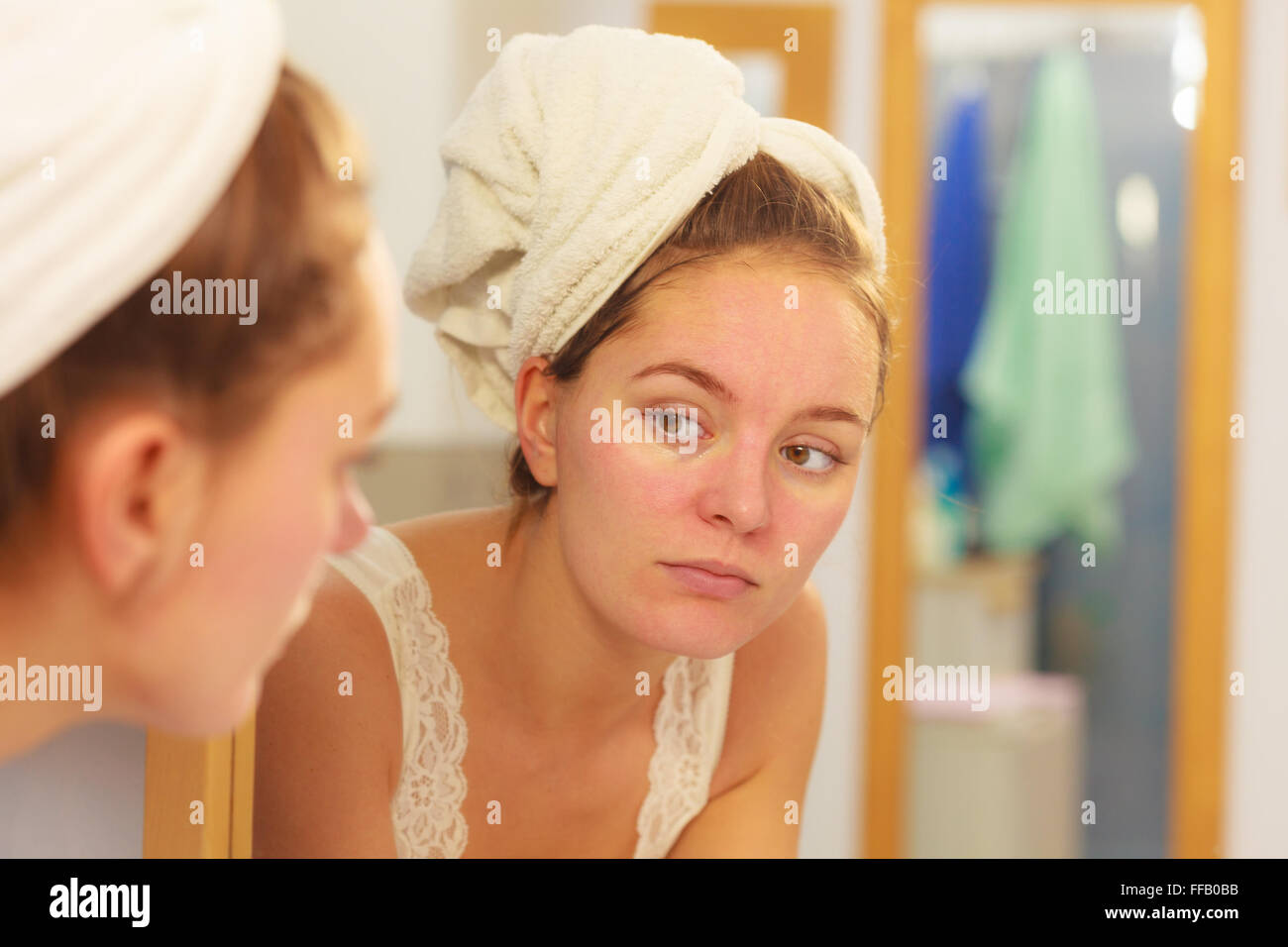 Woman cleaning washing her face with clean water in bathroom. Girl ...