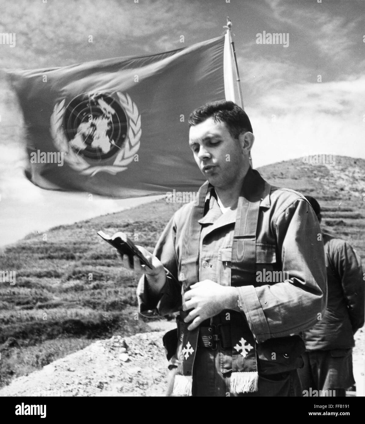 KOREAN WAR: ARMY CHAPLAIN. /nA U.S. Army Catholic chaplain conducting a ...