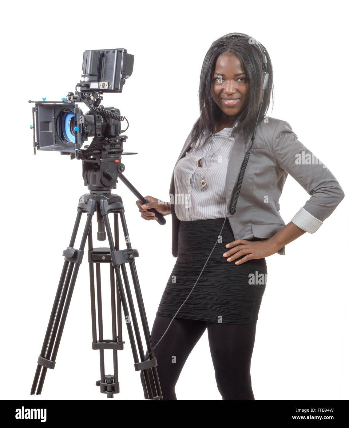 a young African American women with professional video camera and ...