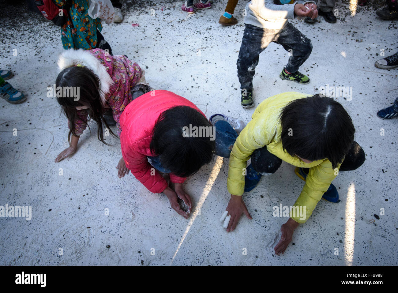 Toyohashi, Japan. 11th February, 2016. Children play with flour during ...