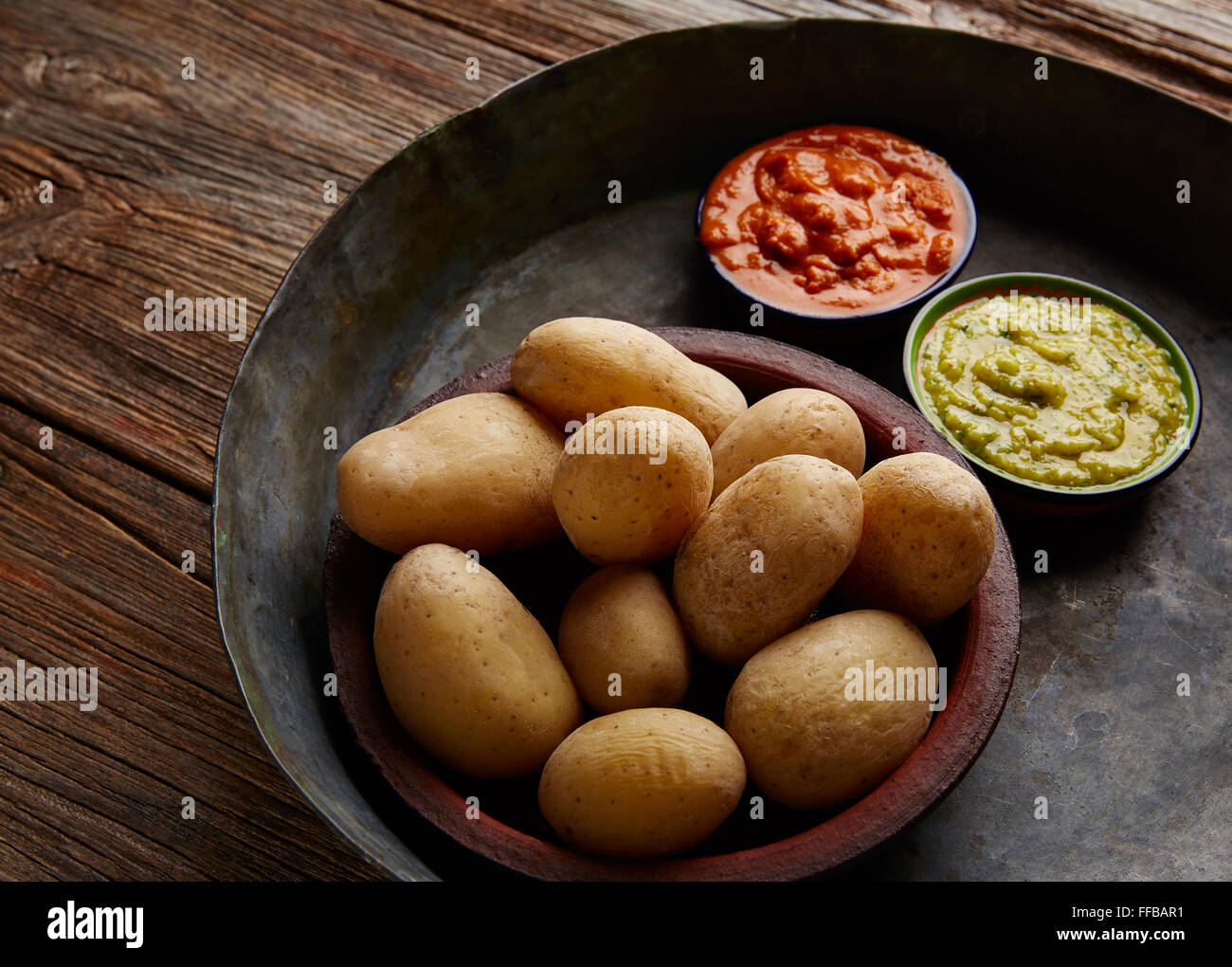 Papas arrugas al mojo Canary islands wrinkled potatoes with green and ...