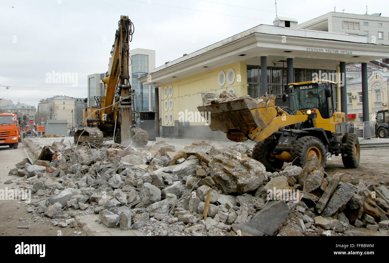 Moscow, Russia. 11th Feb, 2016. A wheel loader and an excavator remove ...