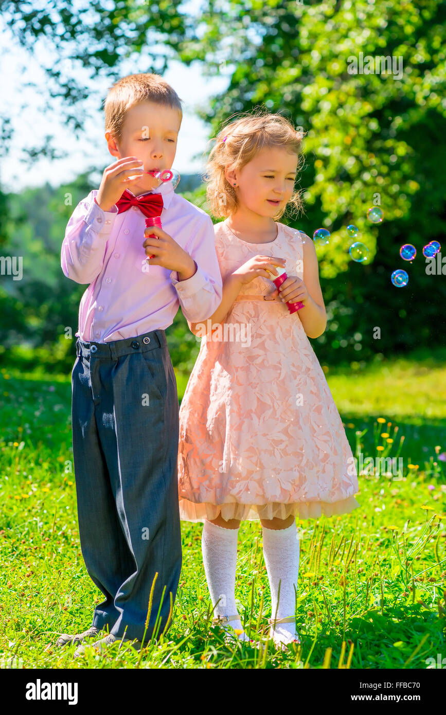Beautiful boy blowing soap hi-res stock photography and images - Alamy