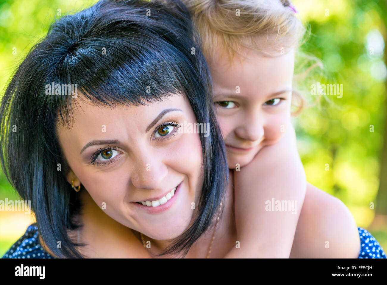 portrait of a beautiful mother and daughter close-up Stock Photo - Alamy
