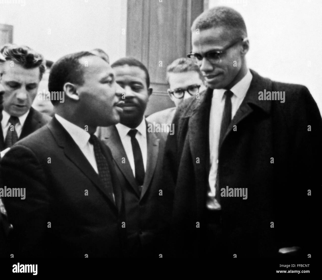 Reverend Martin Luther King and Malcolm X speak while waiting for press ...