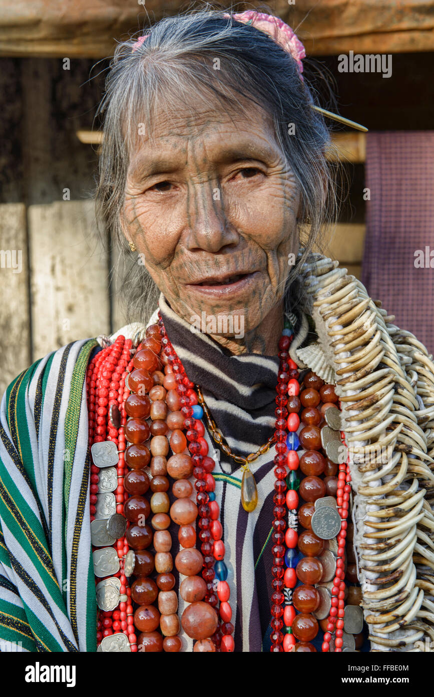 A Muun Chin woman with face tattoos and deer tooth necklace, Mindat ...