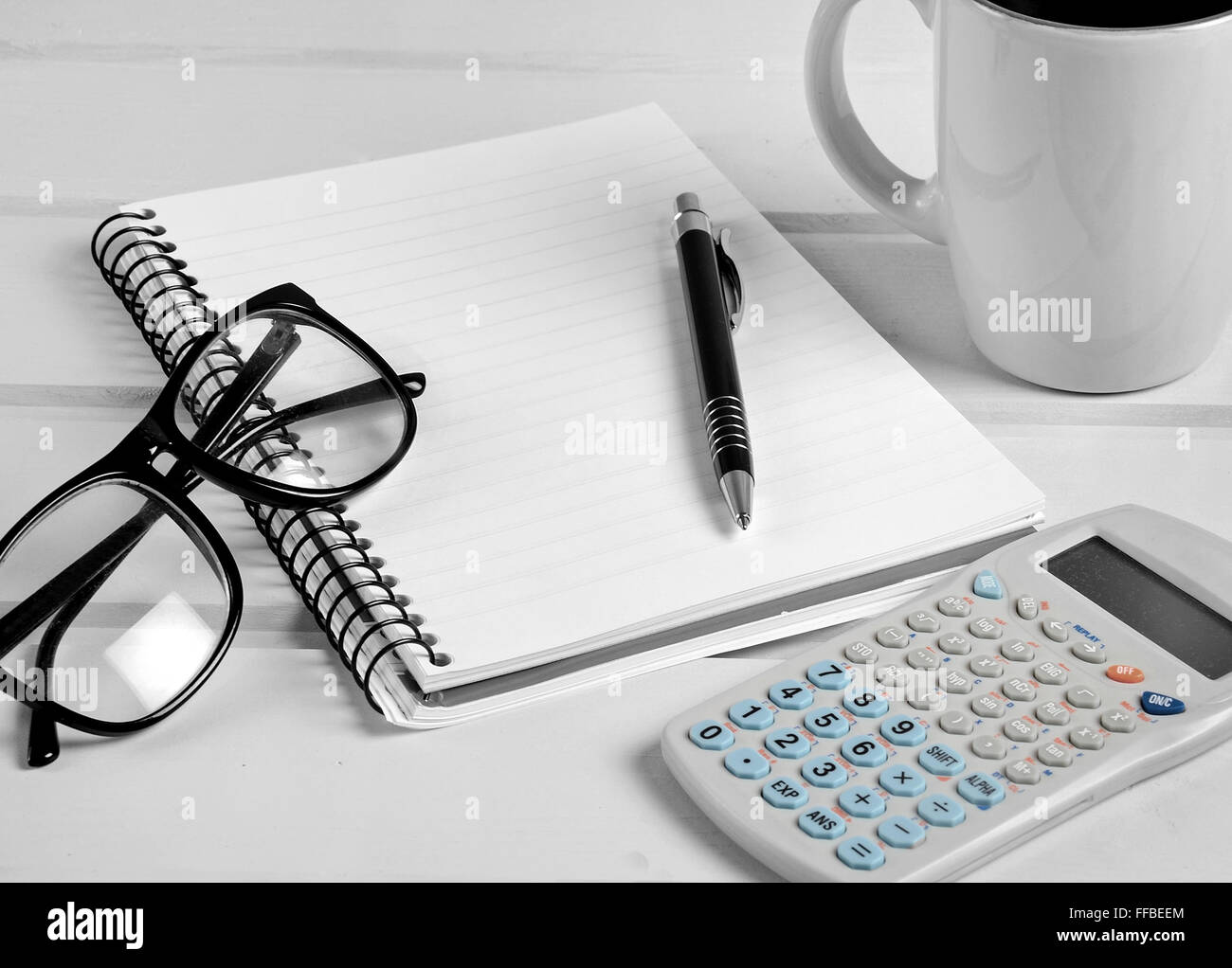 Empty notepad with pen eyeglasses and calculator Stock Photo - Alamy