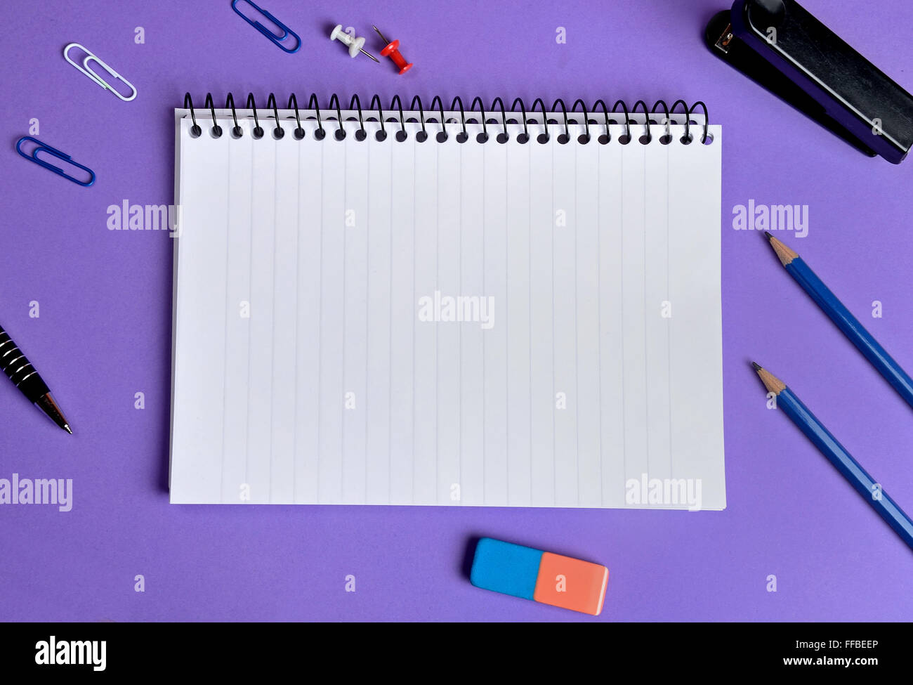 Empty notepad with office supplies Stock Photo - Alamy