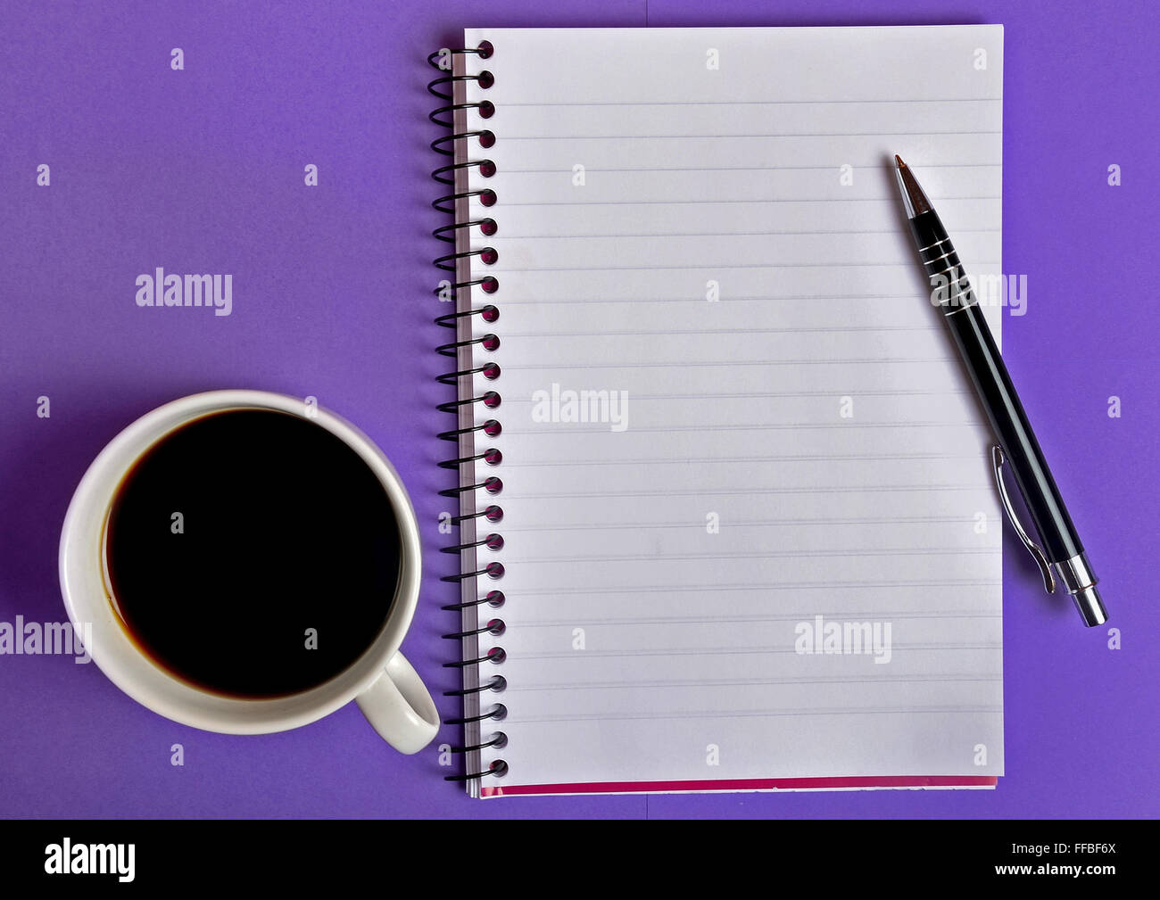 Notepad and coffee on background Stock Photo - Alamy