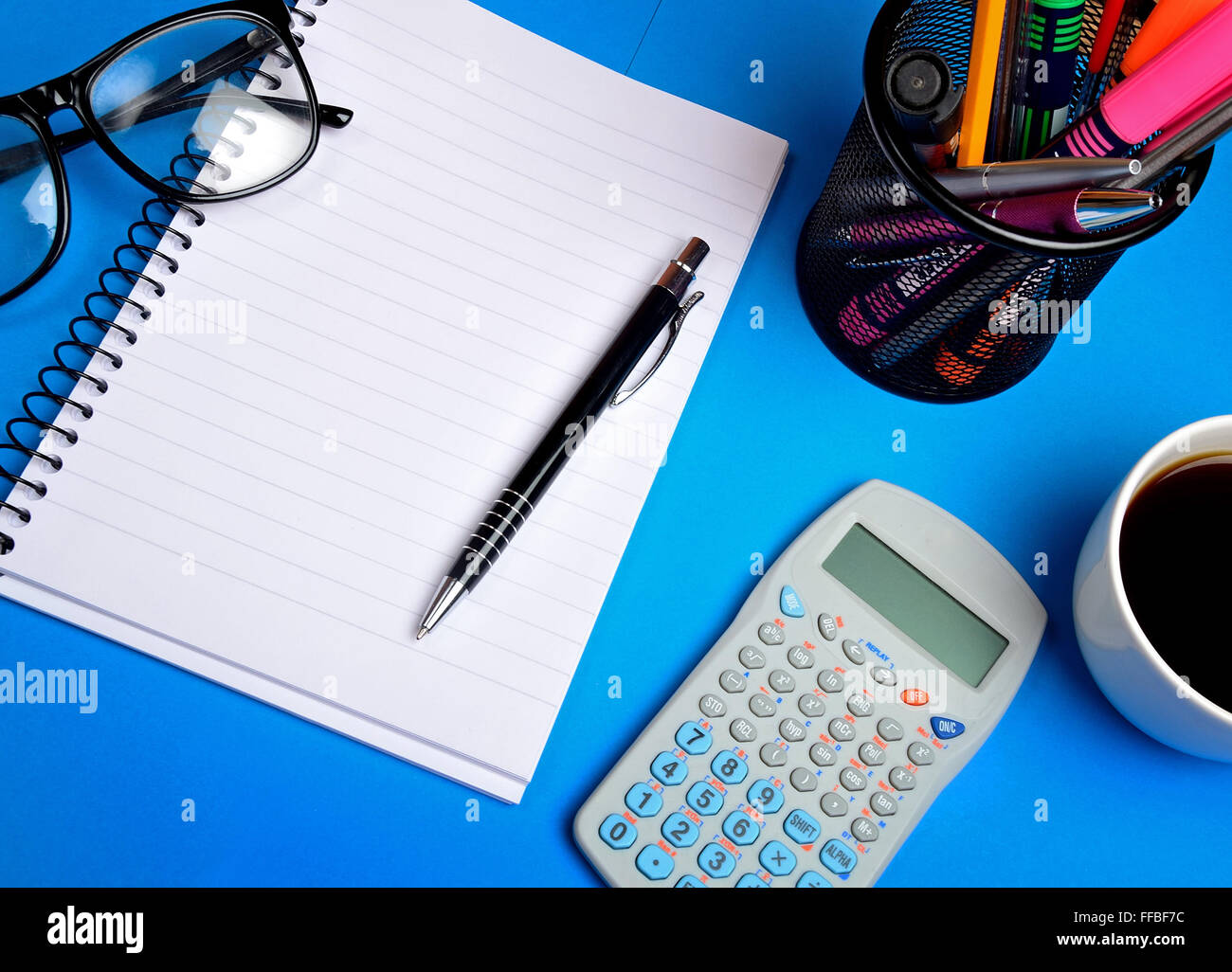 Stationary office on blue background Stock Photo - Alamy