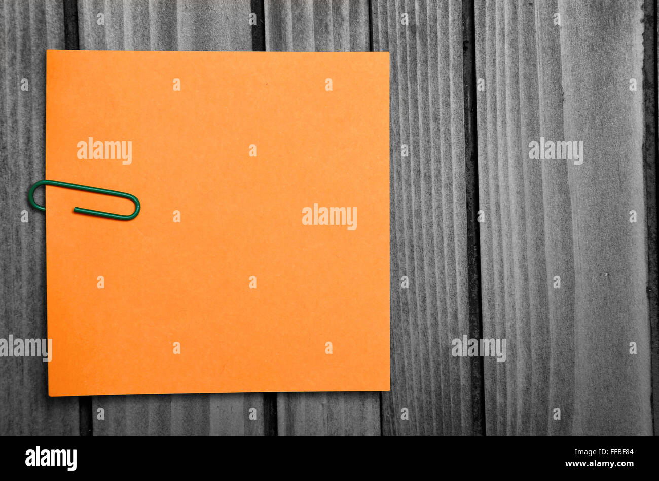Orange notes on wooden wall Stock Photo - Alamy