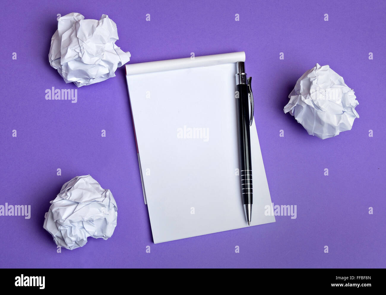 Crumpled paper and notepad on background Stock Photo - Alamy