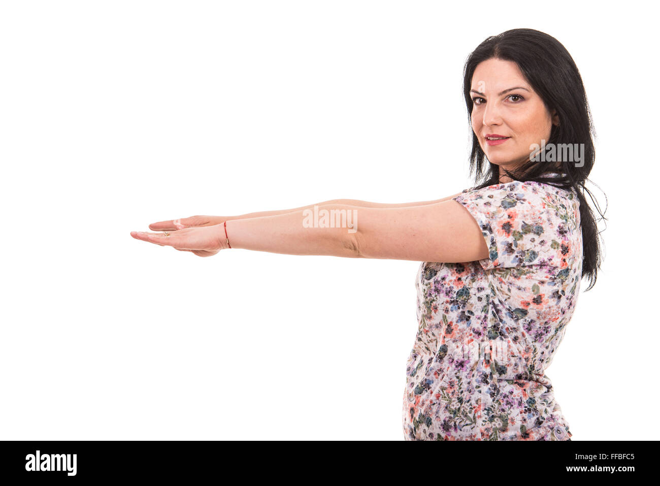 Woman standing in profile with outstretched hands isolated on white ...