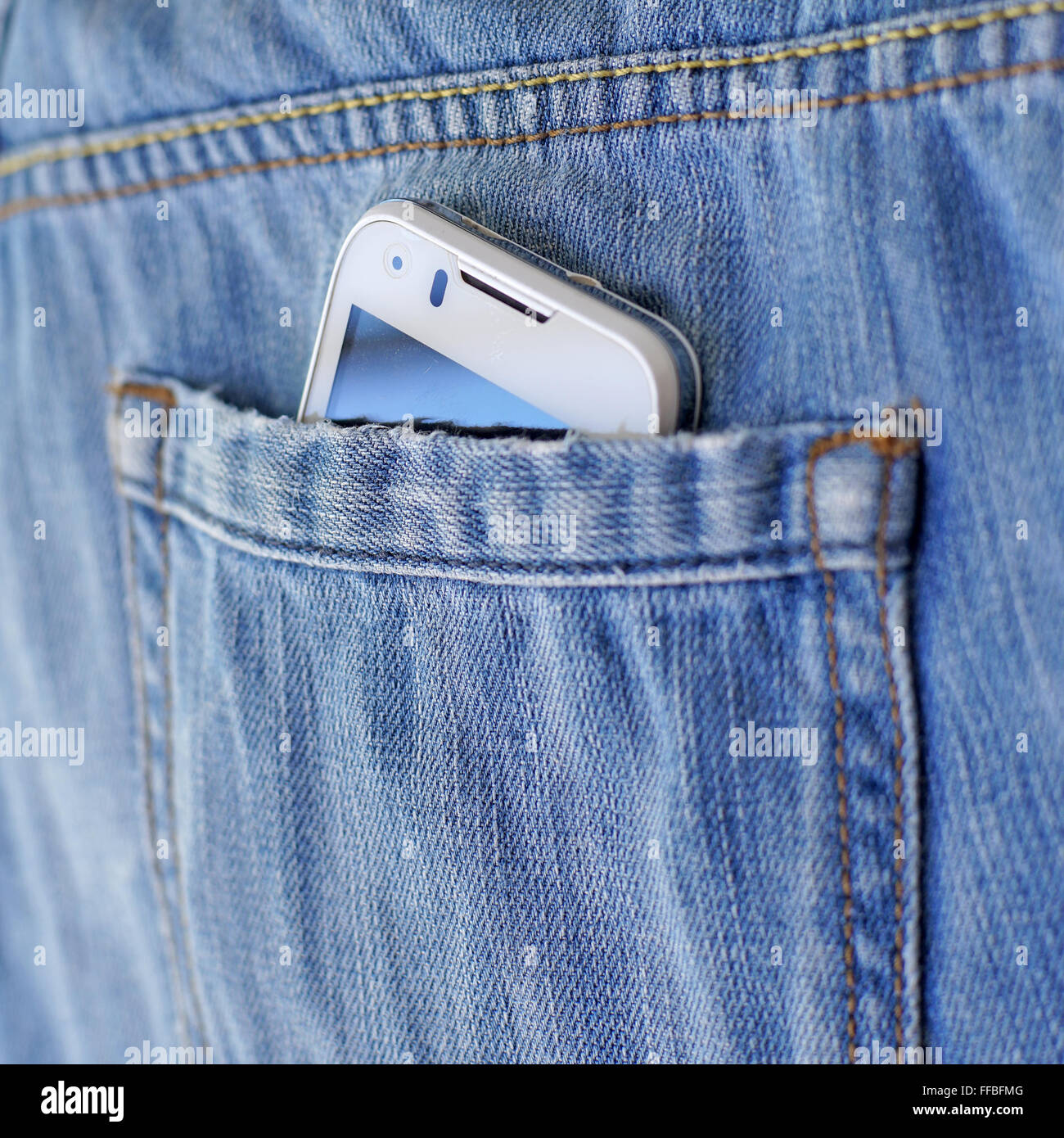 mobile smart phone in back pocket blue jeans Stock Photo - Alamy