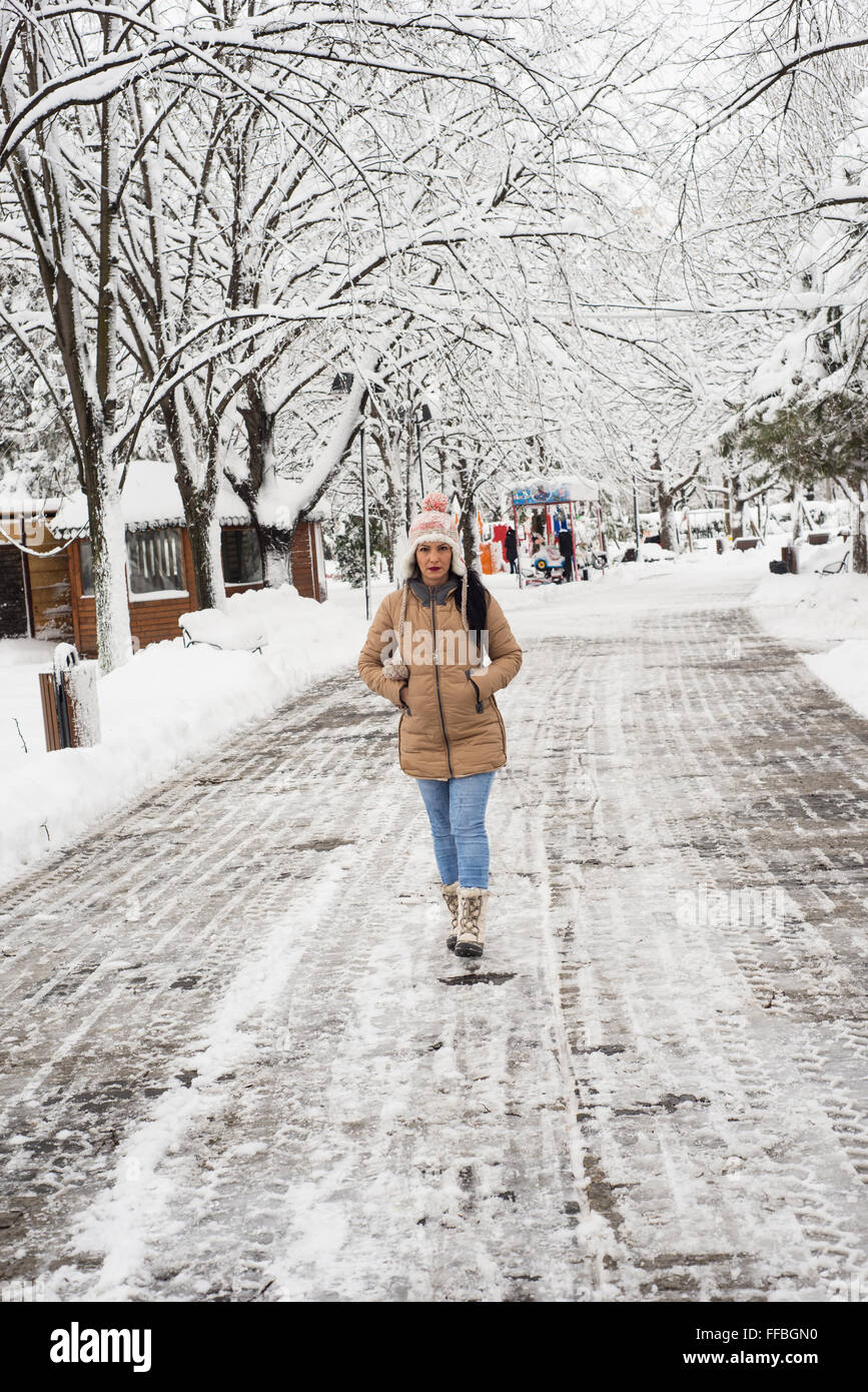 Upset woman walking in park and thinking Stock Photo - Alamy