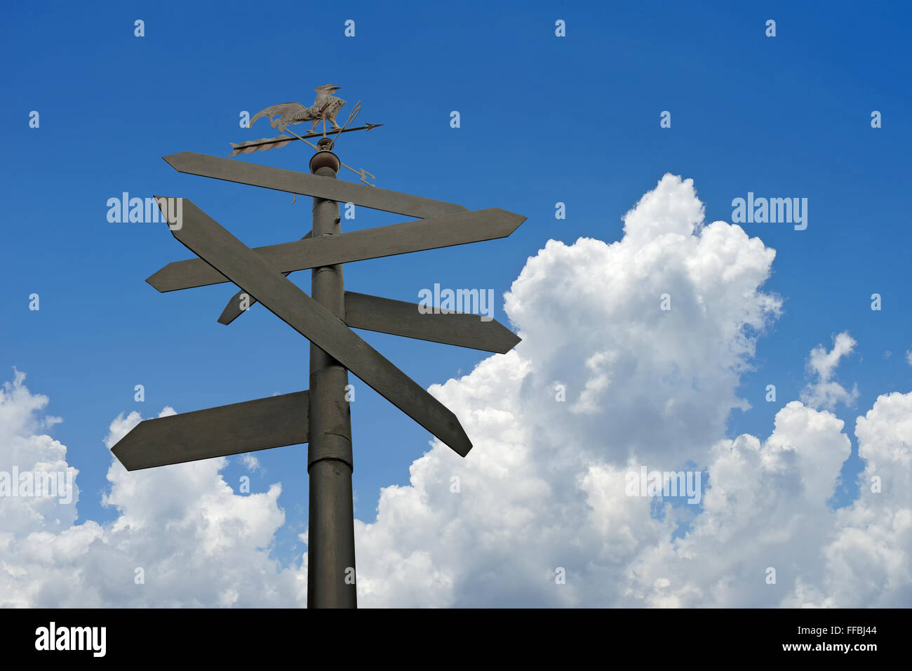 direction sign with blank spaces for text on beautiful sky background ...