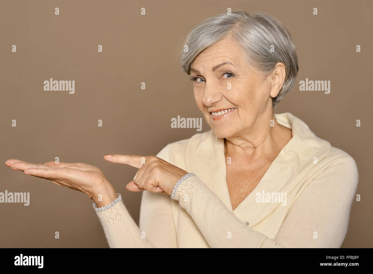 Senior woman pointing Stock Photo - Alamy