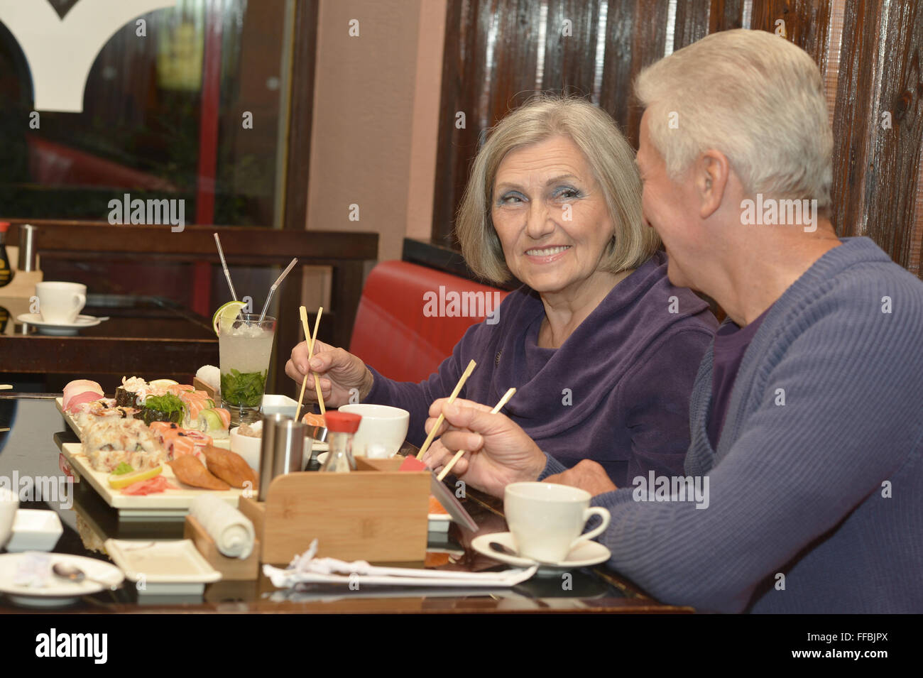 Elderly couple eating Stock Photo - Alamy