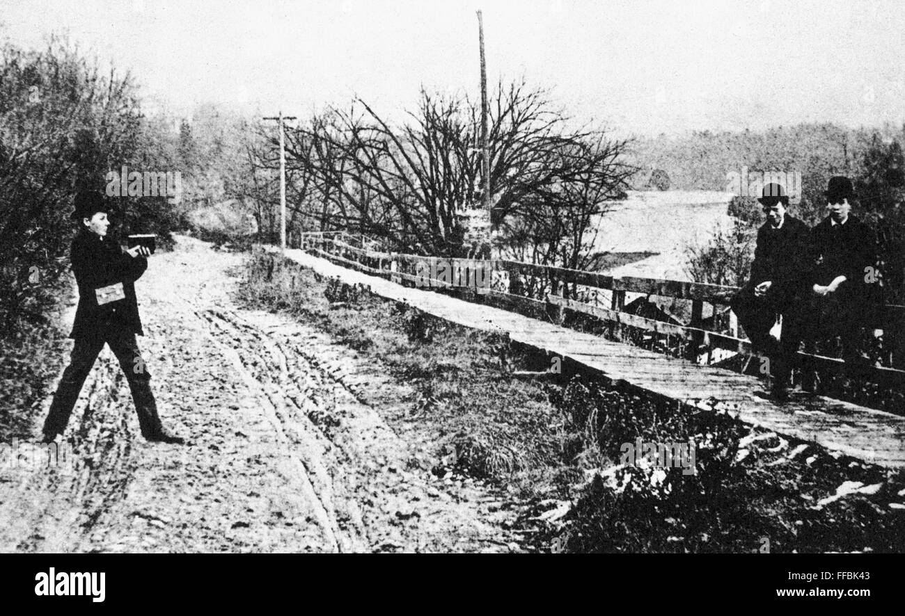 HAND-HELD CAMERA, c1888. /nPhotographer taking a snapshot with the ...