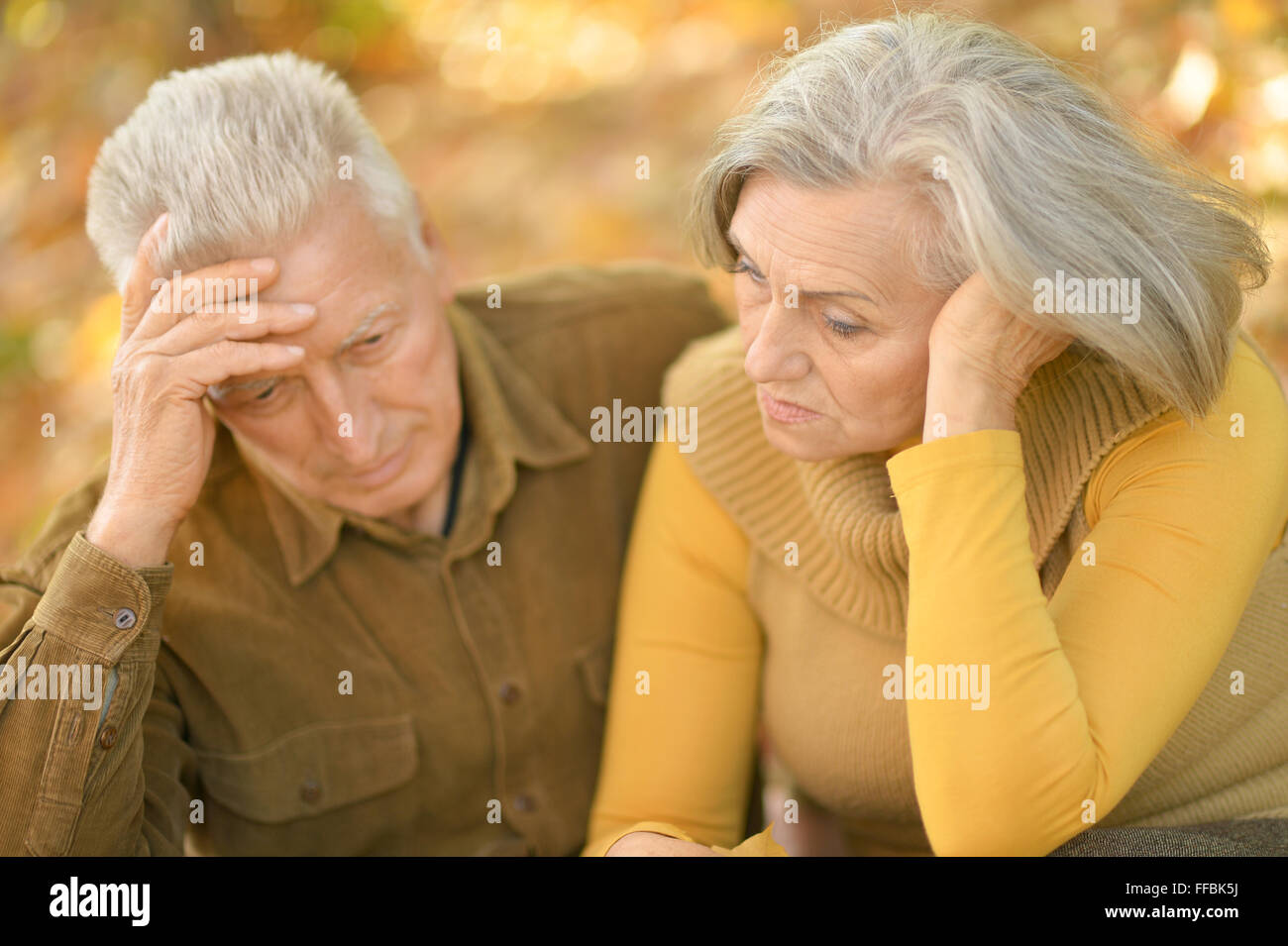 sad elder couple Stock Photo - Alamy