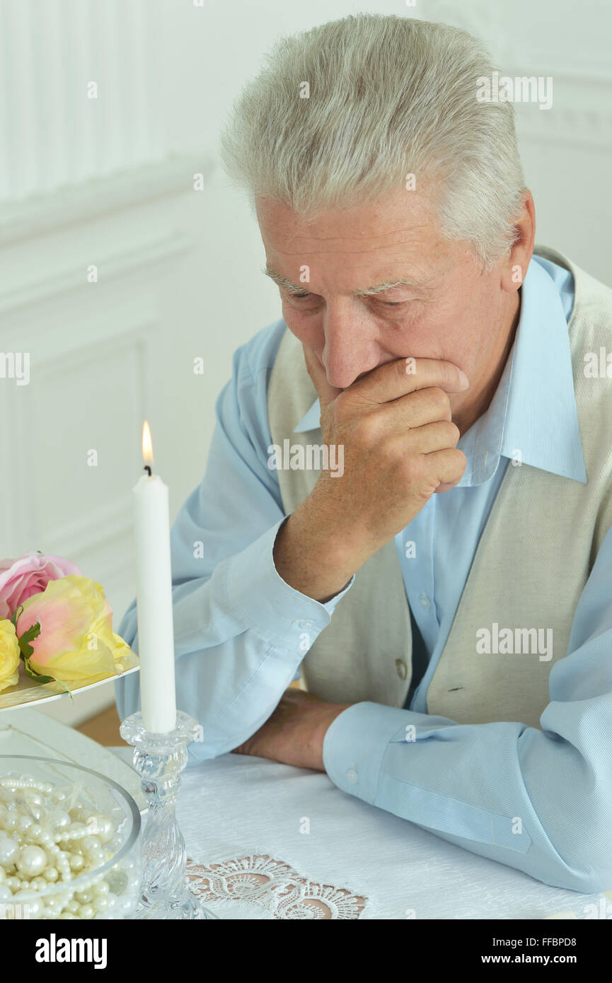 Pensive elderly man Stock Photo - Alamy