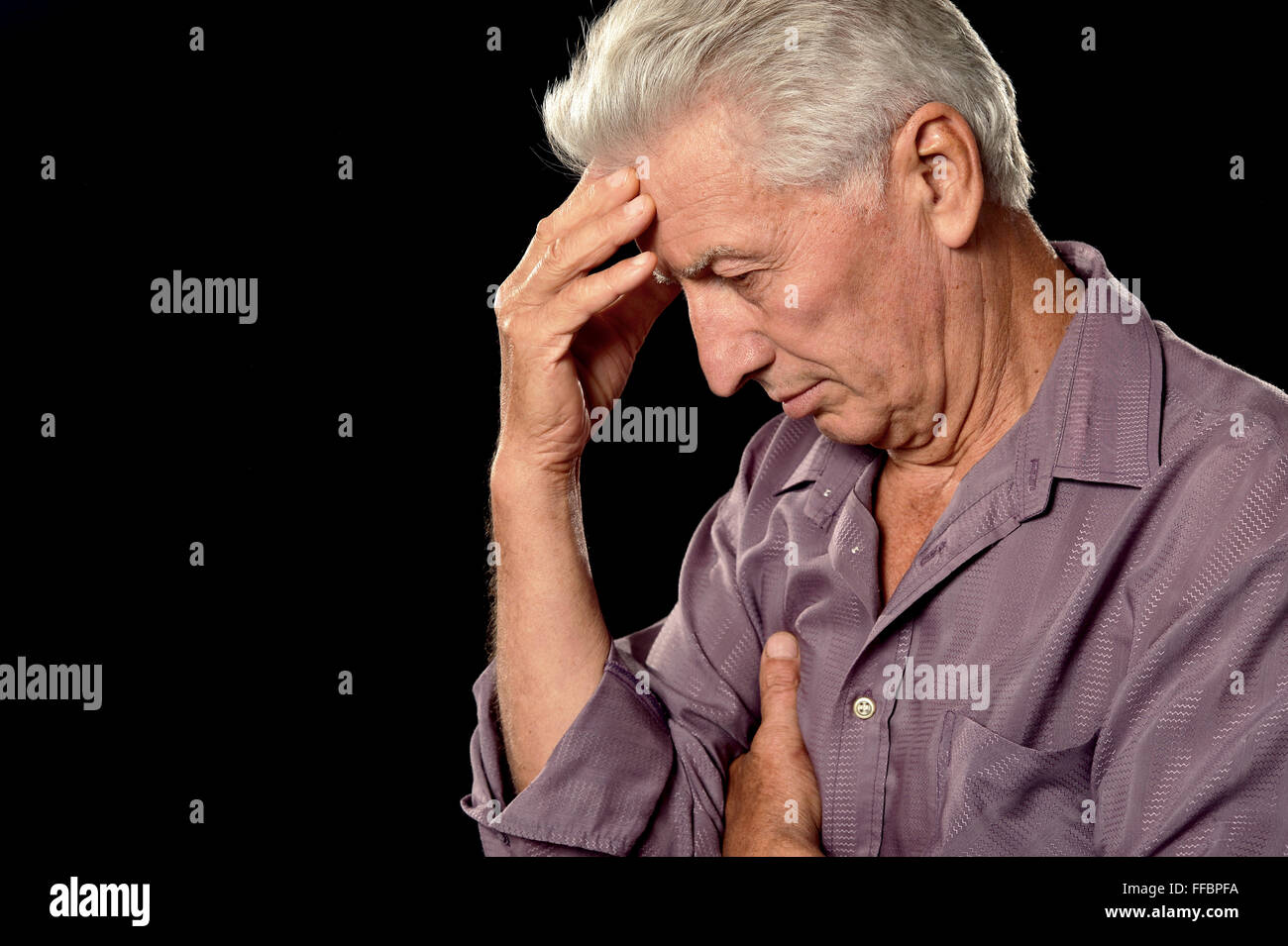 sad old man on a black Stock Photo - Alamy