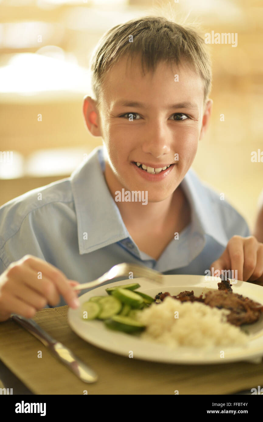 Happy boy at breakfast Stock Photo - Alamy