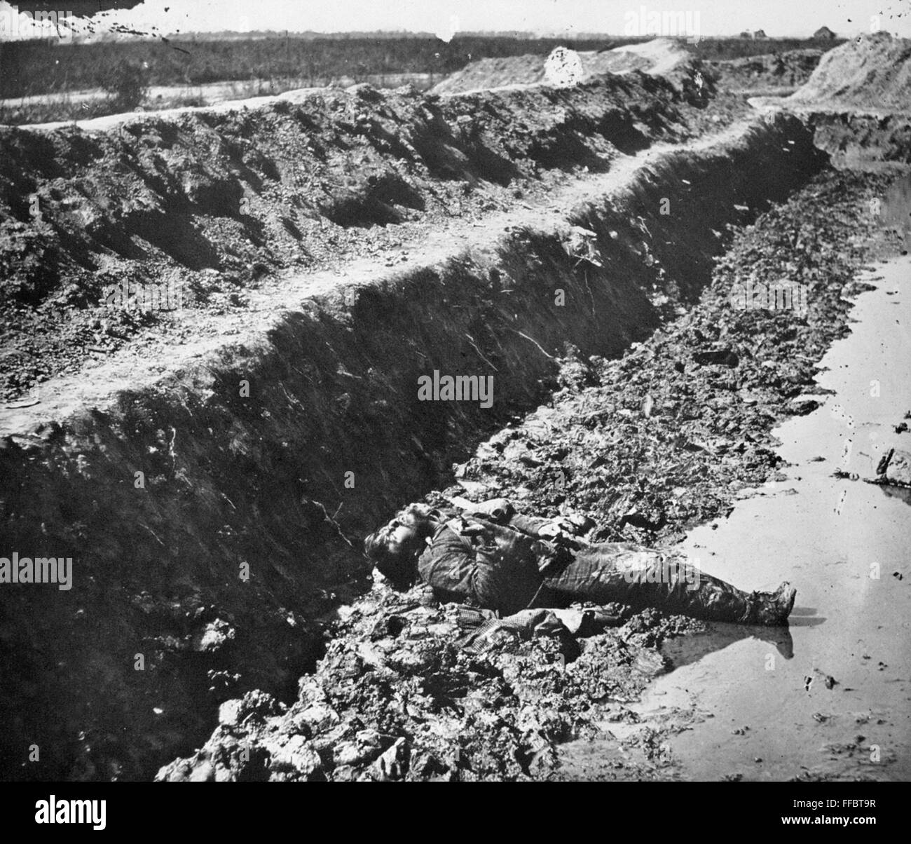 CIVIL WAR: PETERSBURG, 1865. /nA dead Confederate soldier in a trench ...