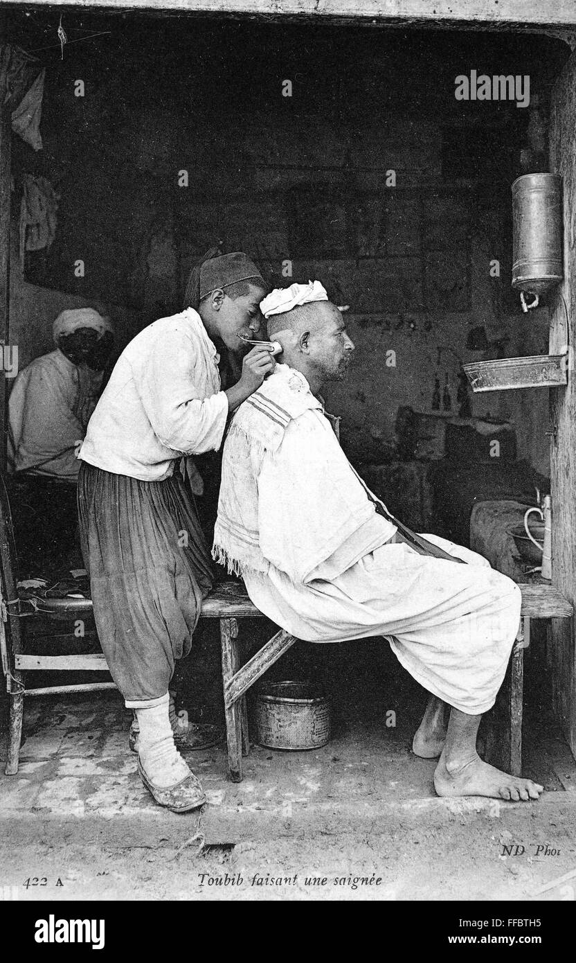 NORTH AFRICA: BLEEDING. /nA North African barber bleeding a patient ...