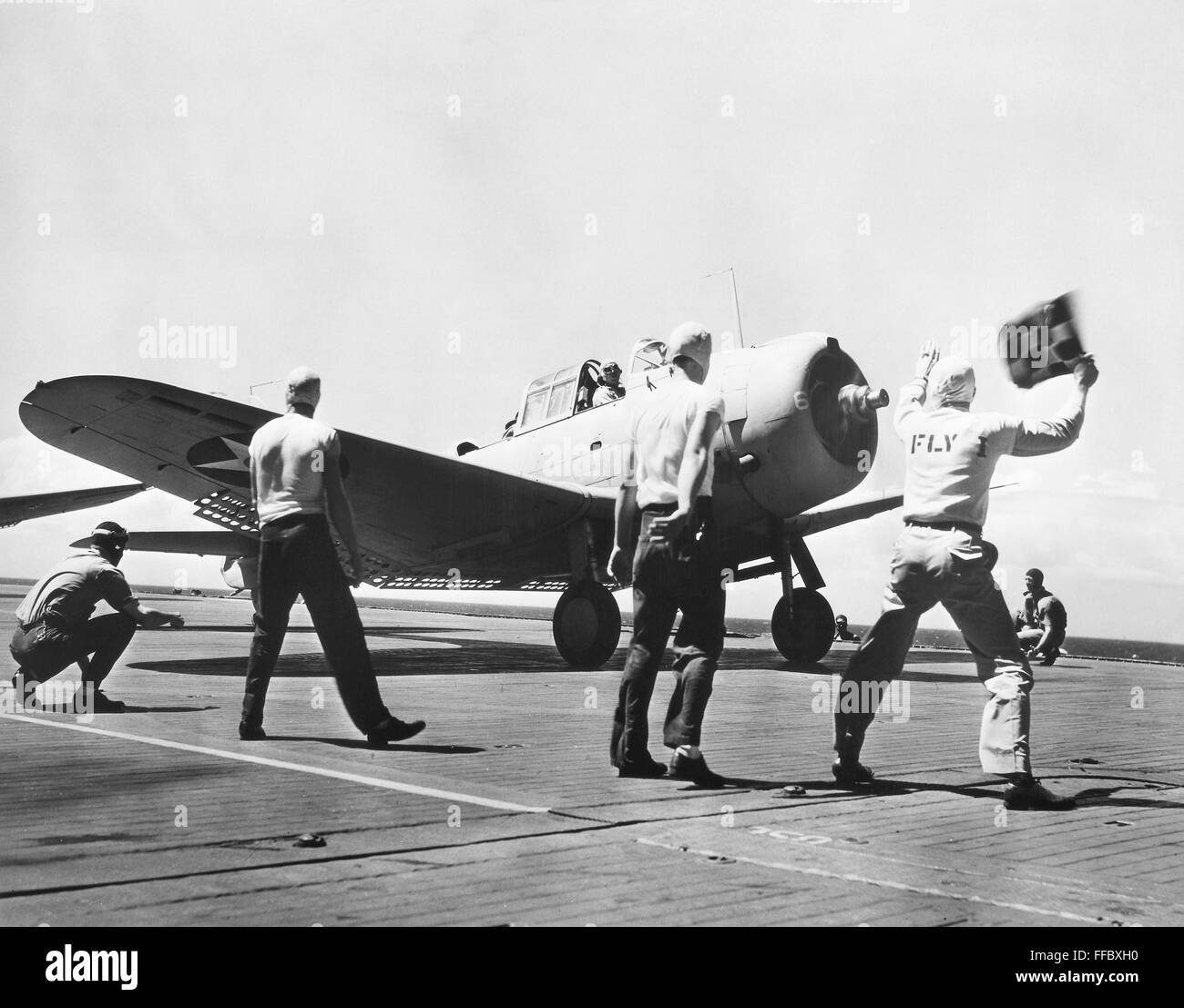 U.S. NAVY AIRCRAFT CARRIER. /n'Fly 1' the take-off signal officer gives ...