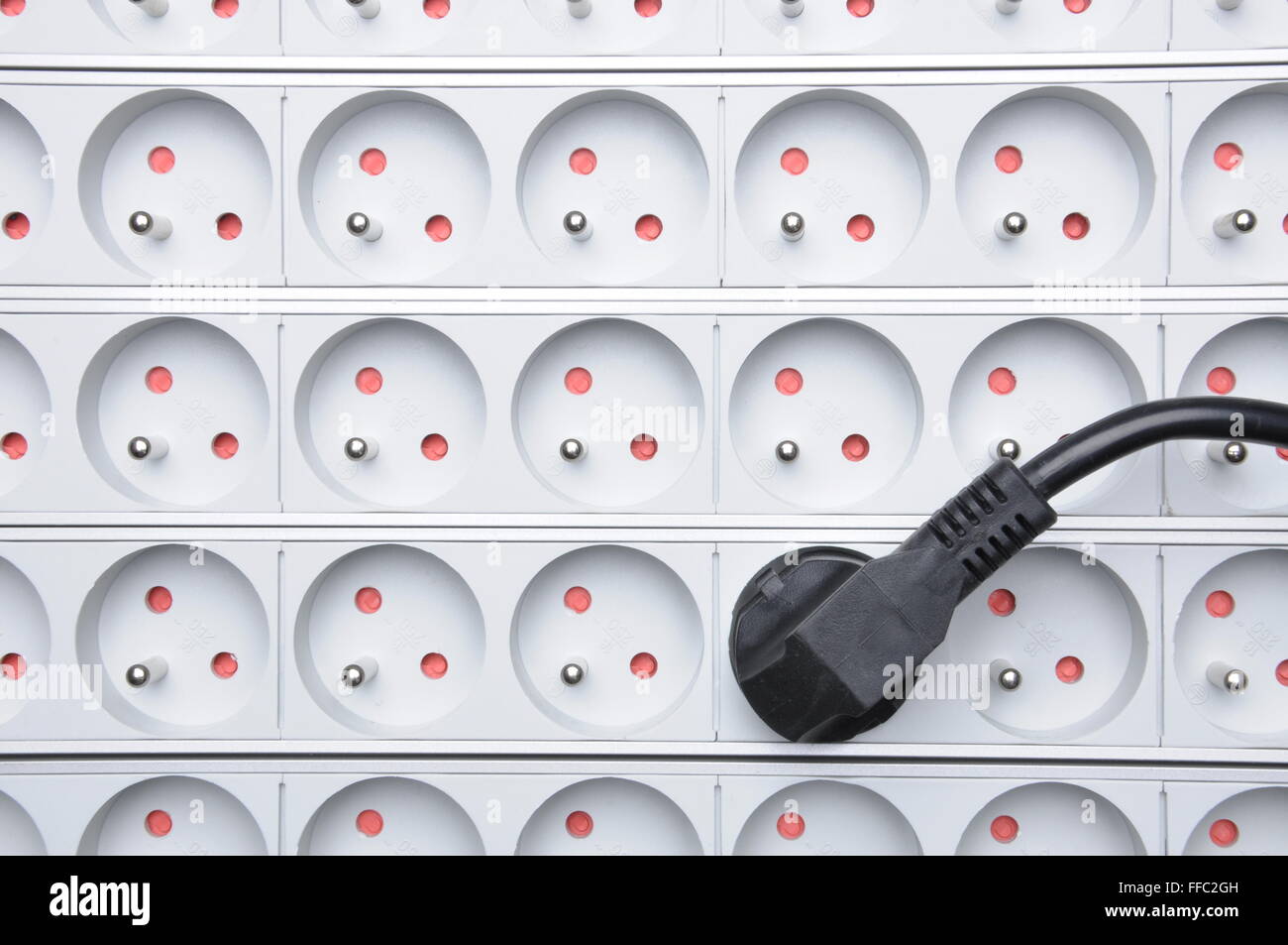 Electrical cords with power strip Stock Photo - Alamy