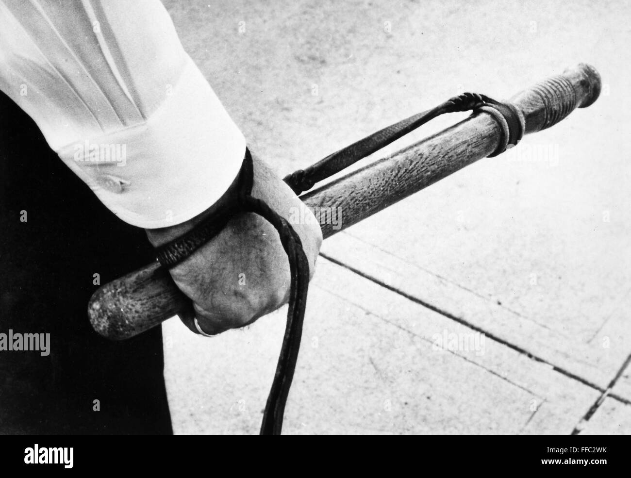 POLICE NIGHTSTICK. /nAn on duty Baltimore police officer holding a ...