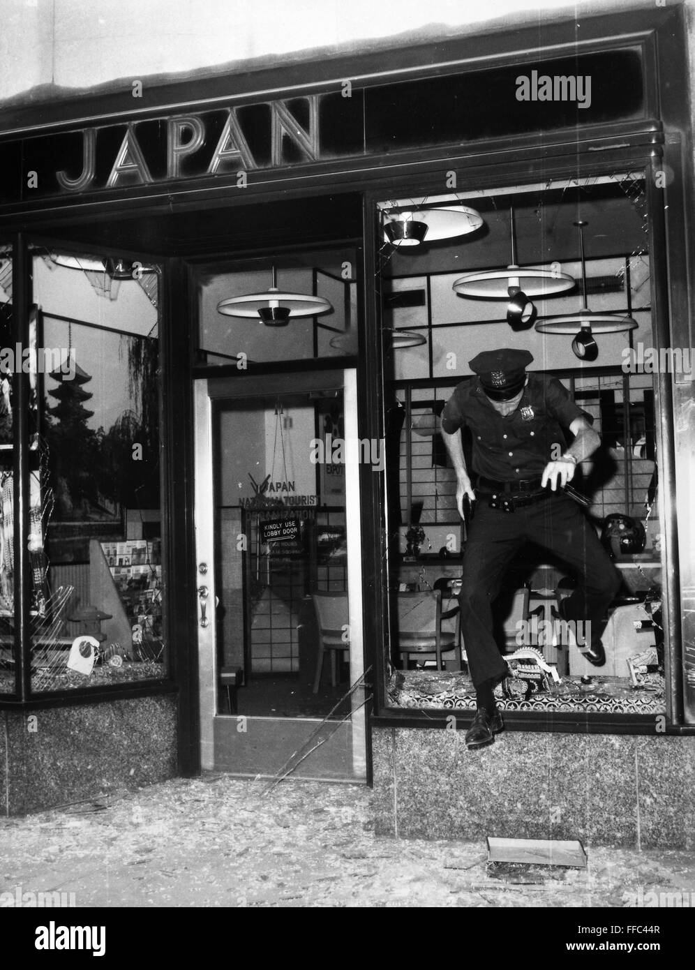 NYC: POLICE OFFICER, 1968. /nA New York City police officer jumps ...