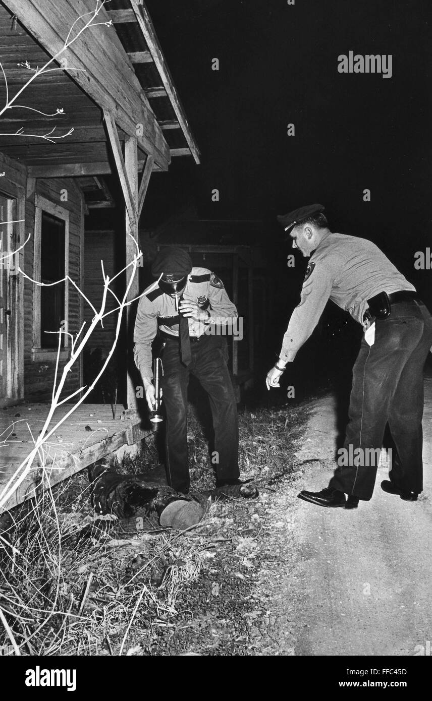 MURDER VICTIM, 1968. /nPolice investigate a murder victim in Houston ...