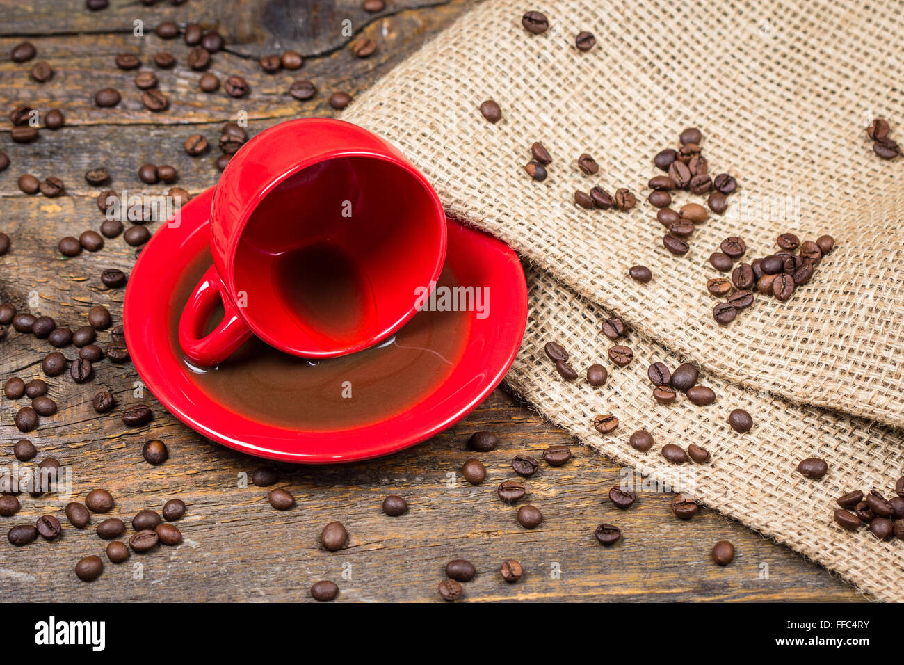 Red coffee cup with spilled coffee and coffee beans Stock Photo - Alamy
