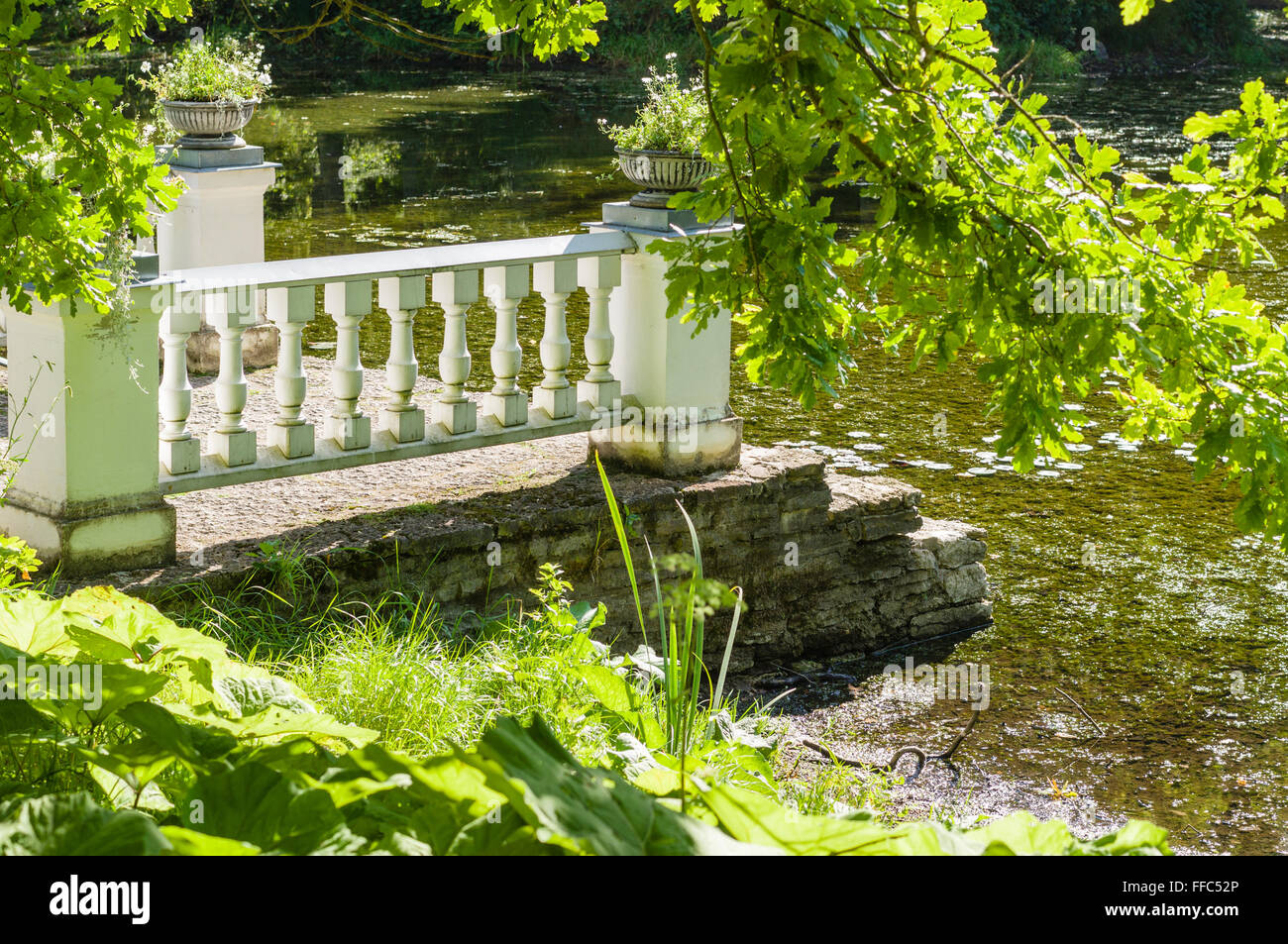Old pier and pond through greenery of Sagadi park, Estonia Stock Photo ...