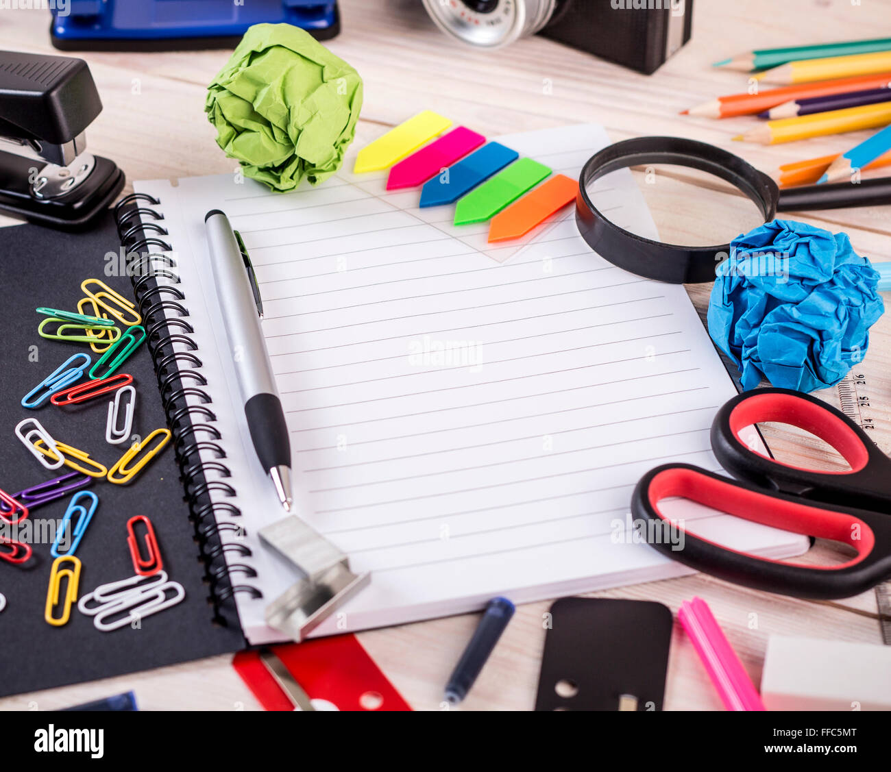 Office supplies on wooden desk with place for text Stock Photo - Alamy