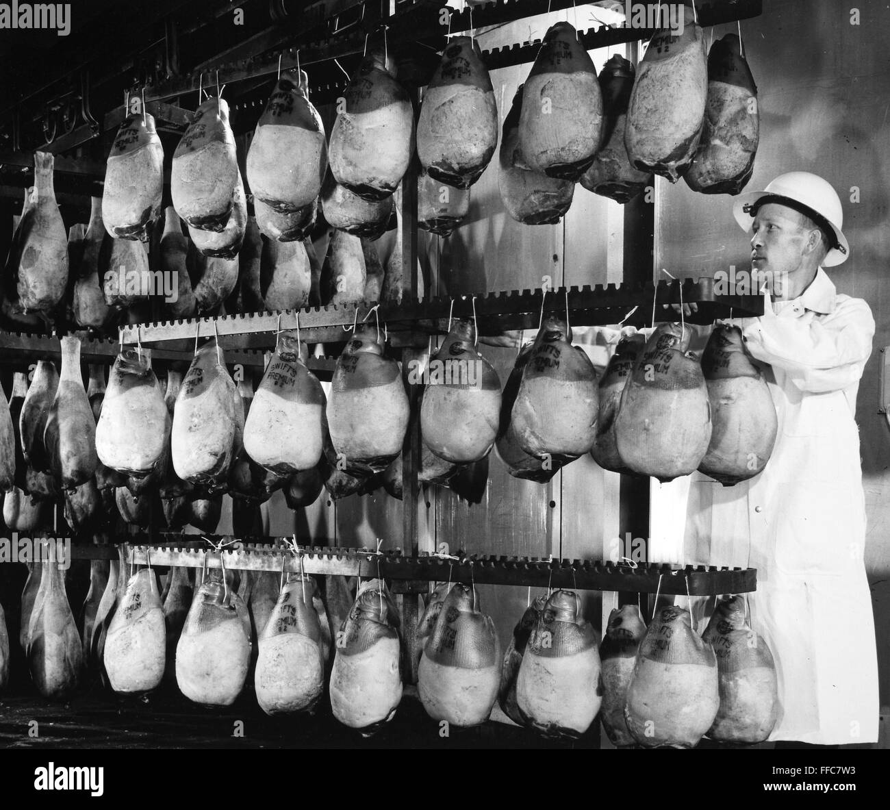 MEATPACKING: HAMS. /nView of the 'ham trees' being pushed into the ...