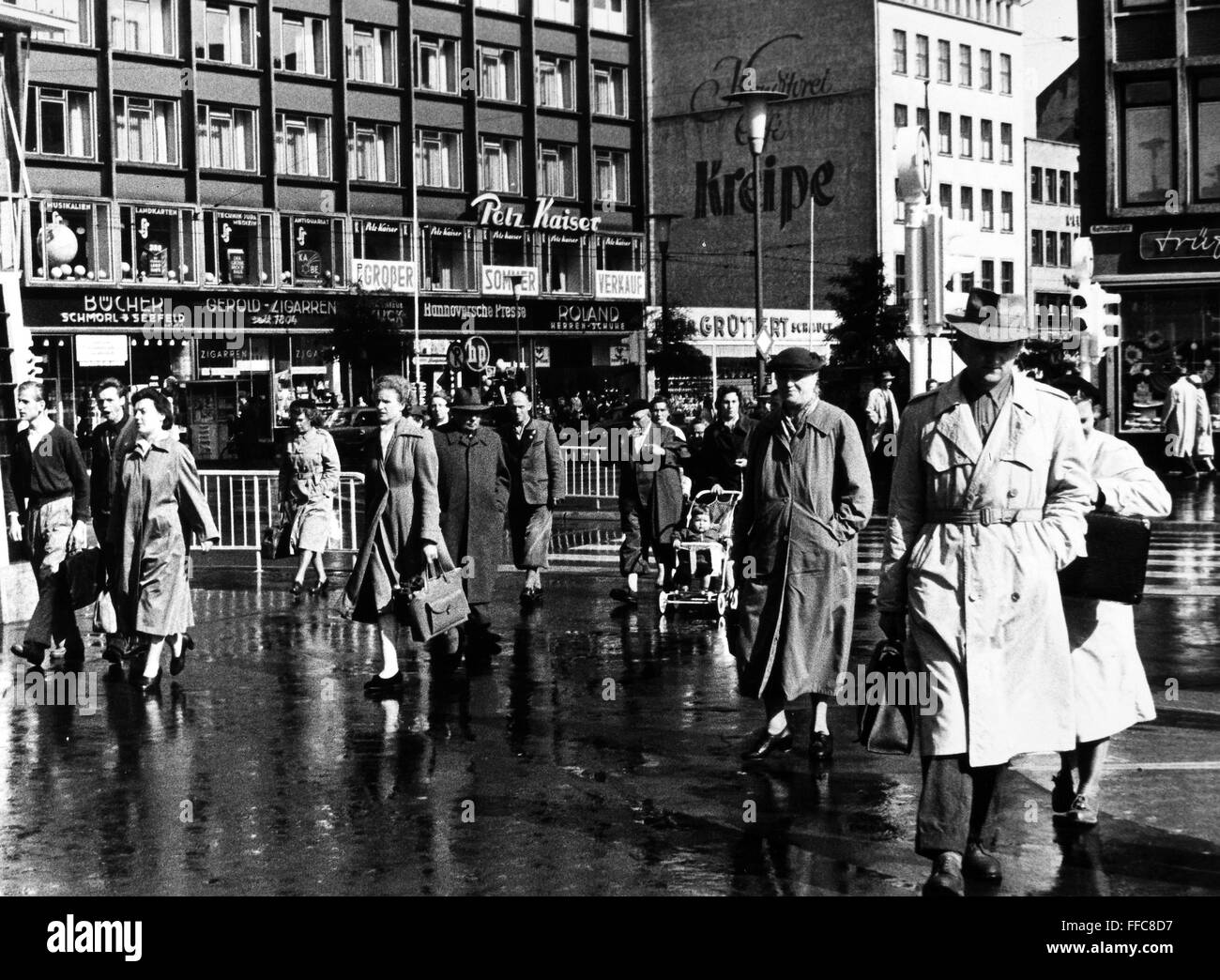 GERMANY: HANOVER, 1956. /nPedestrians crossing an intersection in a ...