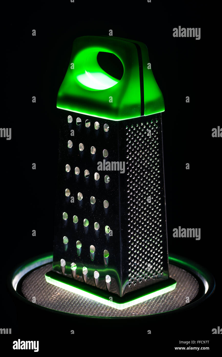 Food grater with green handle Stock Photo - Alamy