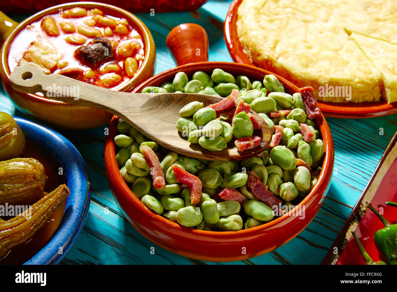 Tapas lima beans with iberico ham from Spain on wood Stock Photo - Alamy