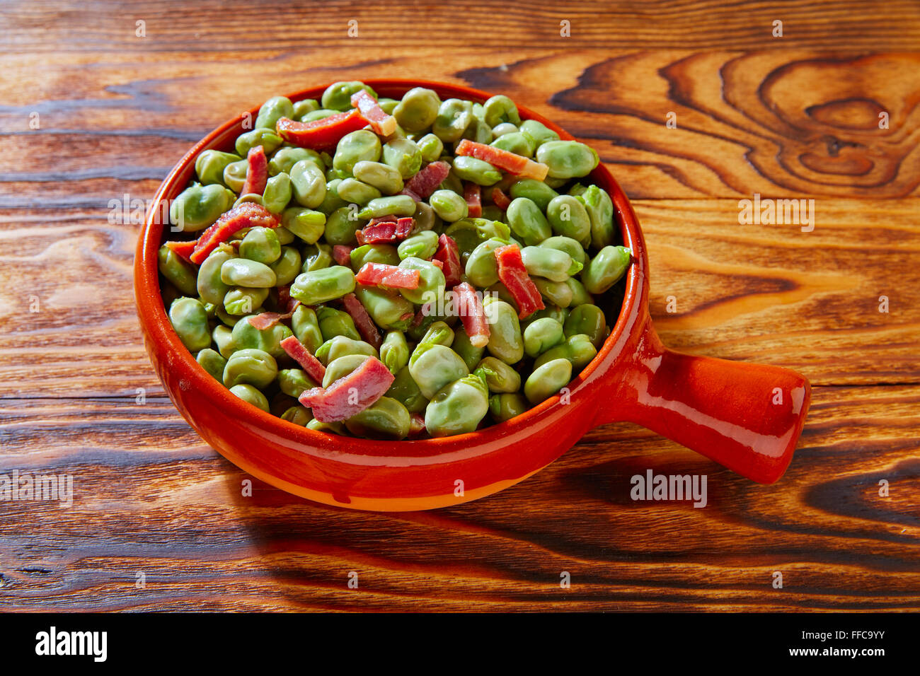 Tapas lima beans with iberico ham from Spain on wood Stock Photo - Alamy