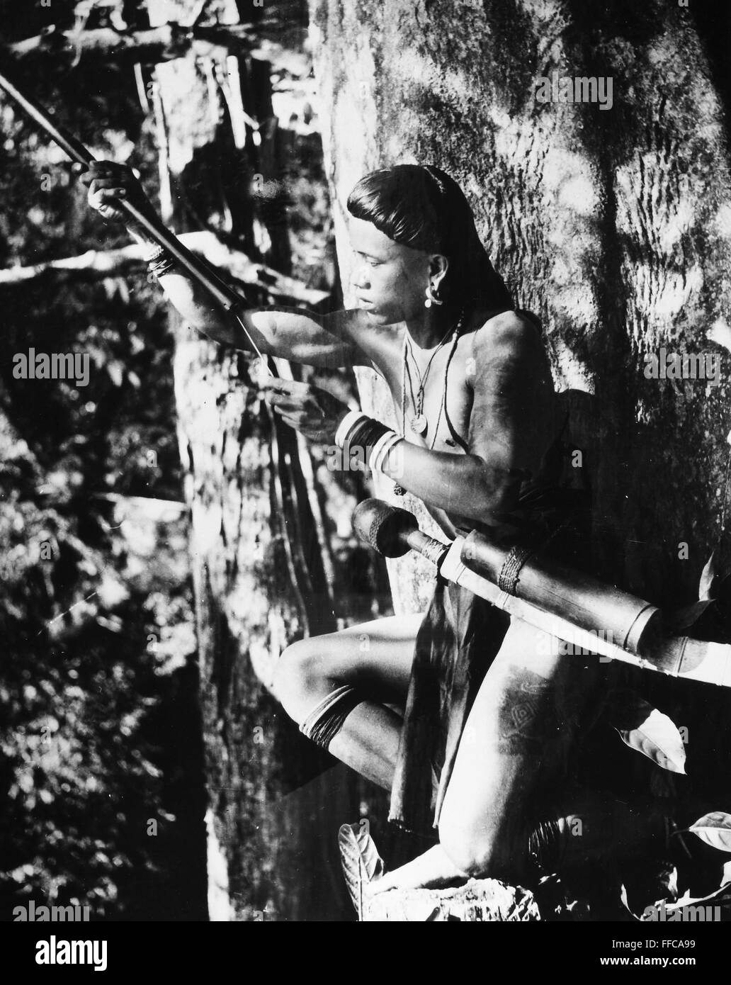 INDONESIA: HUNTER, 1954. /nPrimitive Indonesian man on a hunt ...